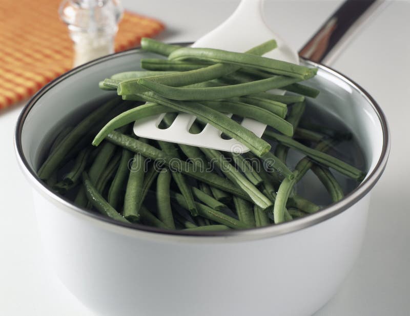 Putting the Green Beans in the Boiling Water Stock Image - Image of ...