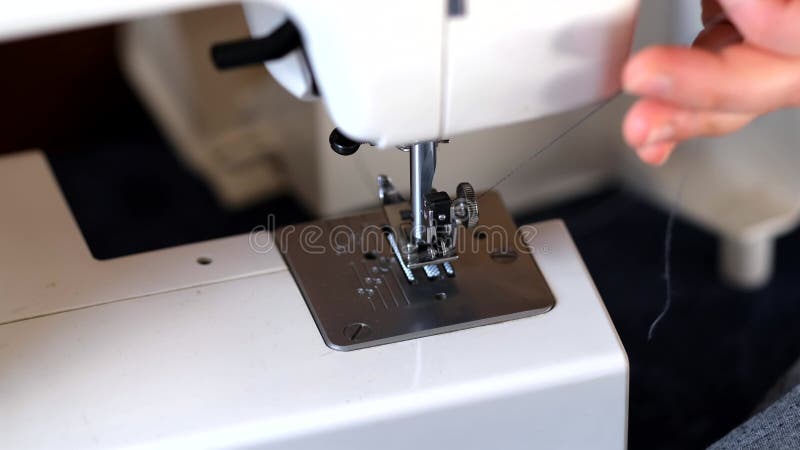 Putting a Thread into a Sewing Machine Stock Footage - Video of sewing ...