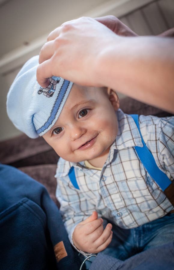 Putting the hat on stock photo. Image of curious, home - 51725526