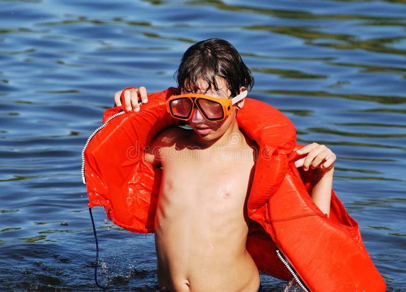 Putting on Life-jacket stock image. Image of diving, child - 5918159