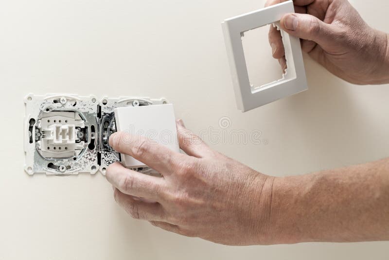 Putting light switch cover stock image. Image of fitter - 36269773