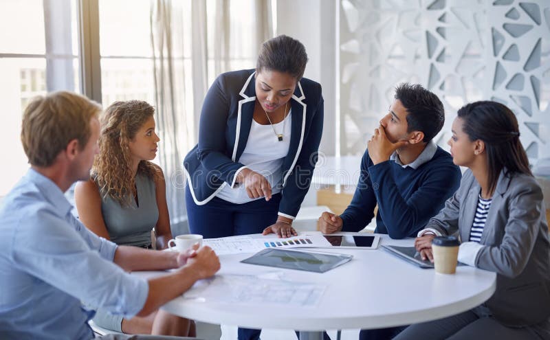Putting the Numbers into Perspective. a Group of Colleagues Discussing ...