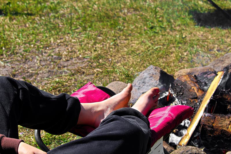 Putting One`s Feet Up and Relaxing by the Campfire Stock Image - Image ...