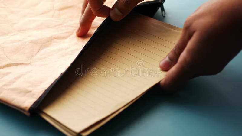 Putting Paper in a Bag on Table Stock Video - Video of table, woman ...