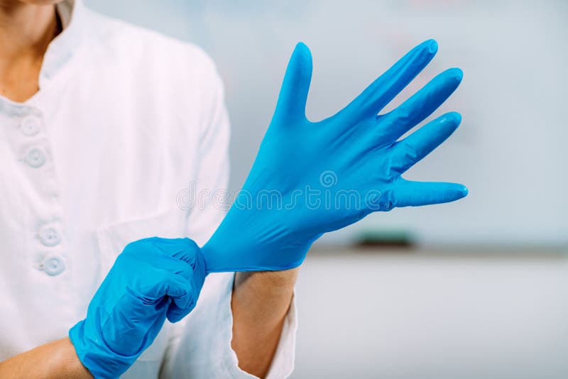 Putting on Protective Gloves. Laboratory Safety Equipment Stock Image ...