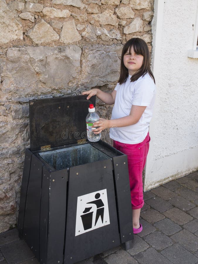 Putting rubbish in the bin stock image. Image of throw - 32815763