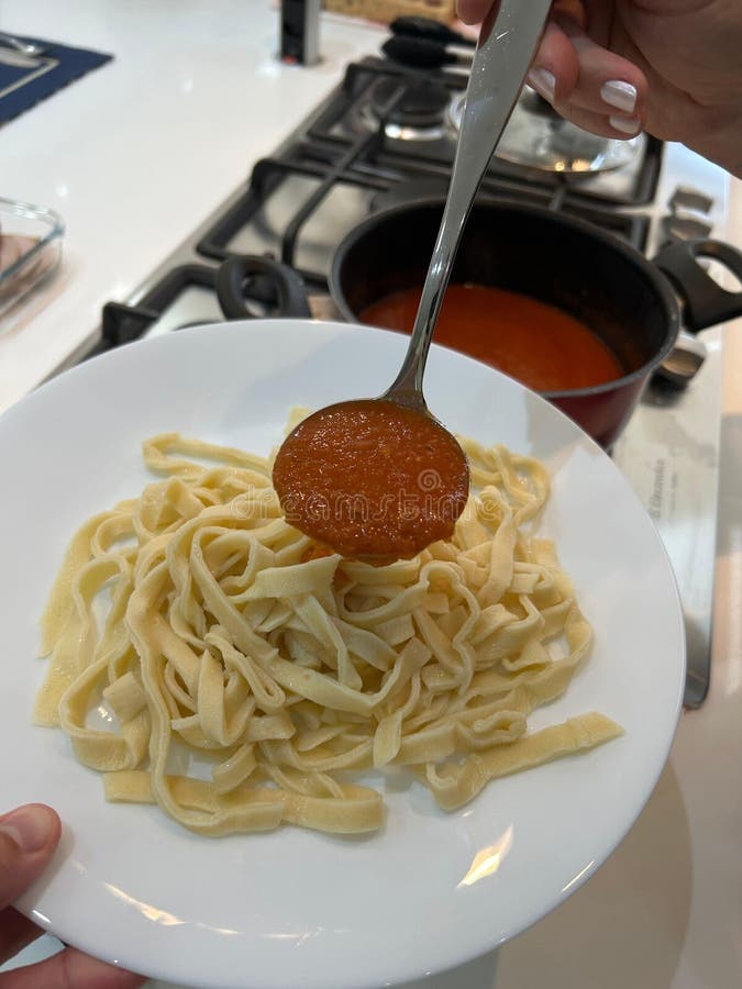 Putting Sauce on a Plate of Homemade Pasta Stock Image - Image of ...