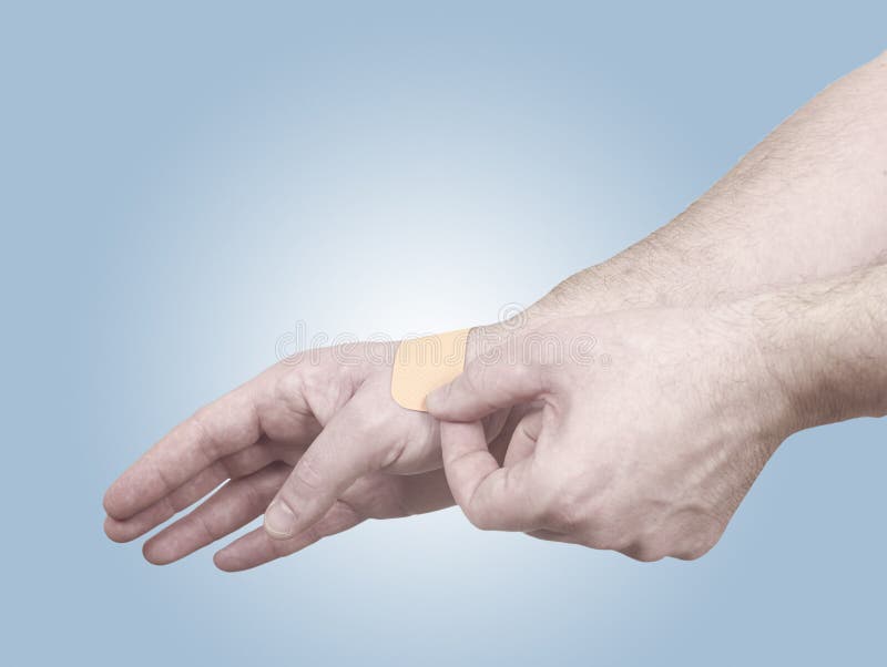 Putting a Small Adhesive Plaster on a Palm. Stock Photo - Image of ...