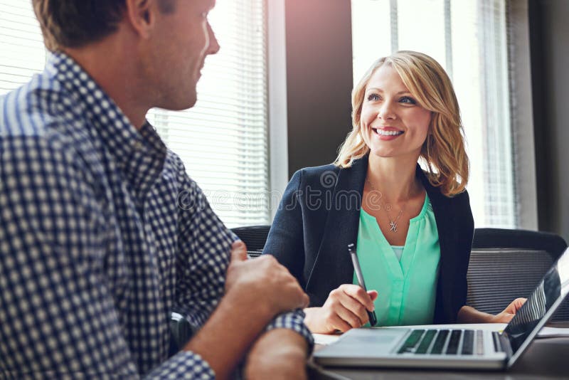 Putting the State of Business into Perspective. Two Colleagues Having a ...