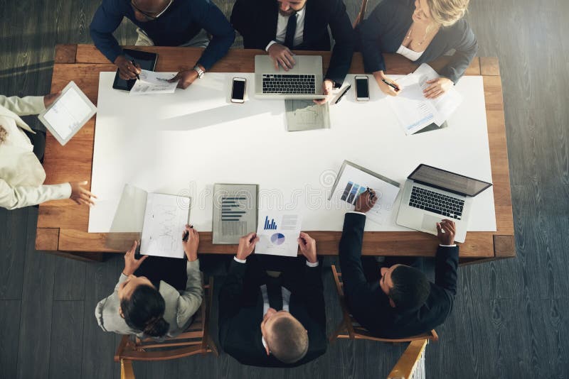 Putting the Team To Work. High Angle Shot of a Team of Businesspeople ...