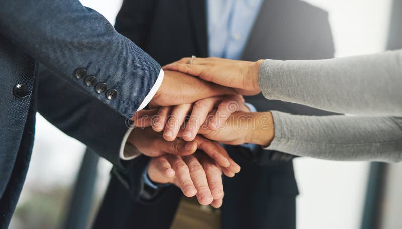 Putting Teamwork into Action. a Team of Colleagues Joining Their Hands ...