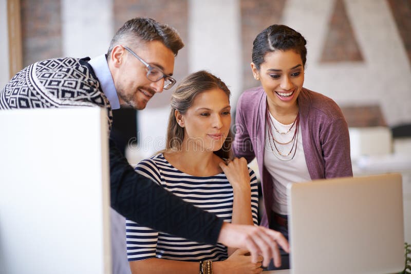 Putting Their Minds Together on a Project. a Group of Designers Working ...