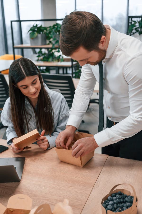 Putting Them on the Table. Man and Woman are with Eco Boxes in the Office Together Stock Photo ...