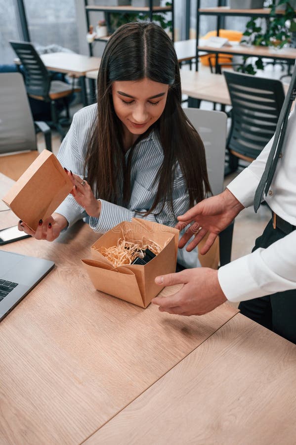Putting Them on the Table. Man and Woman are with Eco Boxes in the ...