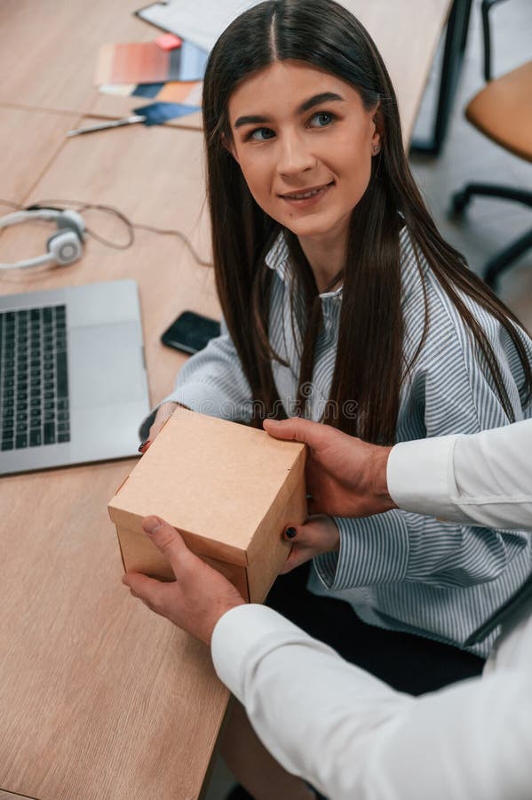 Putting Them on the Table. Man and Woman are with Eco Boxes in the ...