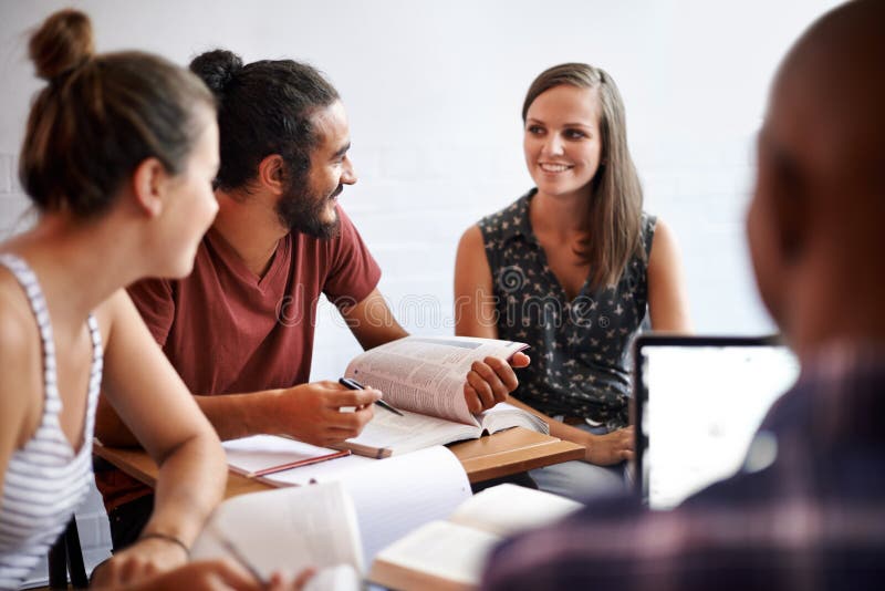 Putting There Assignment in Focus. Shot of a Group of University ...