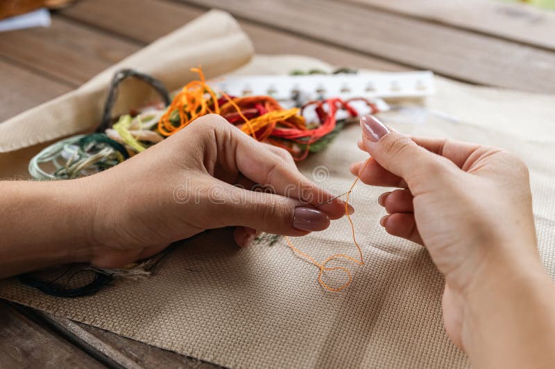 Putting the Thread through the Eye of the Needle. Close-up of the Cross ...