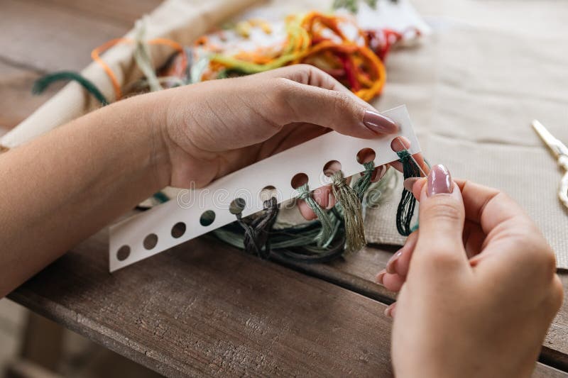 Putting the Thread through the Eye of the Needle. Close-up of the Cross ...