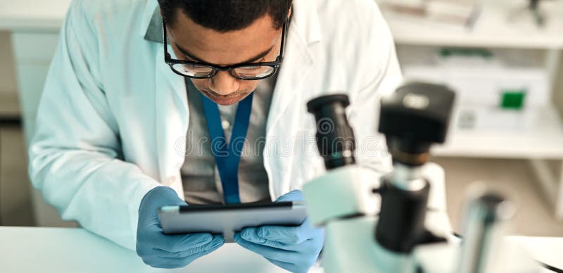 Putting Together a New Research Portfolio. a Young Scientist Using a ...
