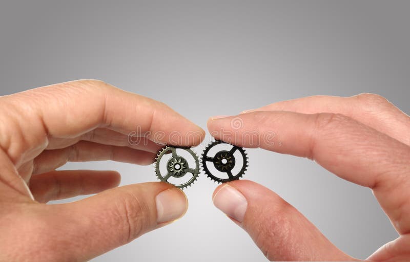Putting two gears together stock image. Image of progress - 87386445