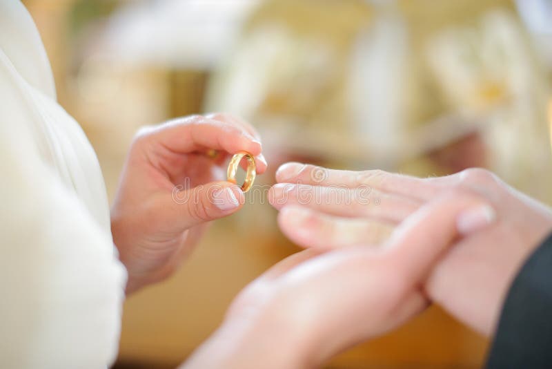 Putting On The Wedding Ring Stock Image - Image of putting, groom: 36312667