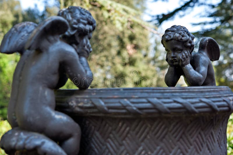 Puttini stock photo. Image of away, cupid, bored, cherub - 46473612