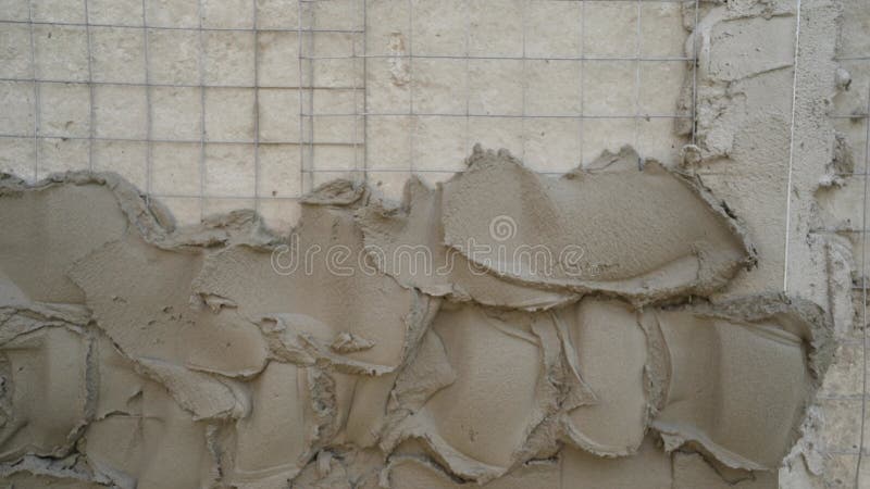 Repair of Walls Using Cement Composition. Putty with Moldings on the ...