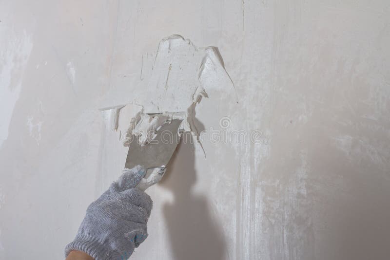 Putty the Wall in the House with Putty Using a Spatula To Level the ...