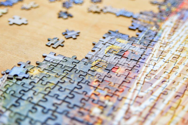 Puzzles Not Fully Assembled are on a Wooden Table. the Concept of ...