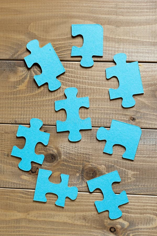 Puzzle Details in Disassembled Form on the Table Stock Image - Image of ...