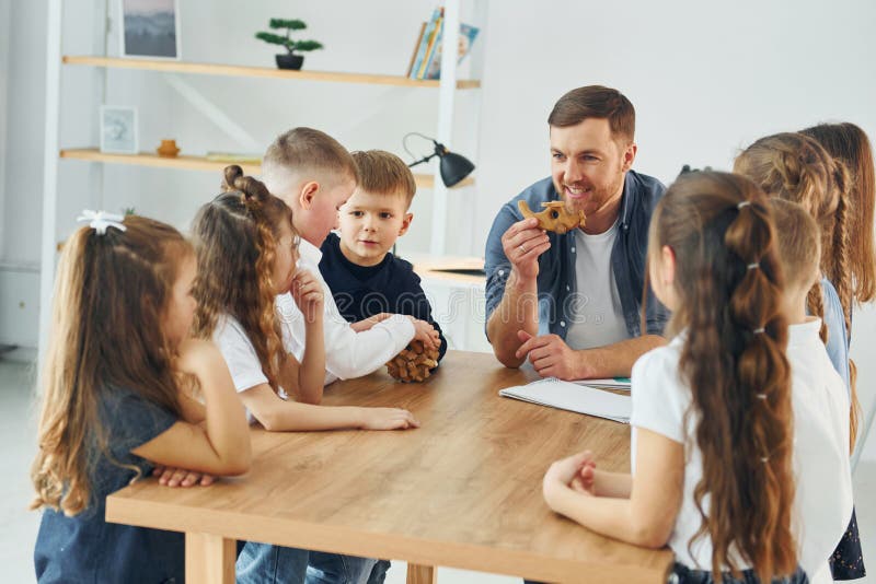With Puzzle. Group of Children Students in Class at School with Teacher ...