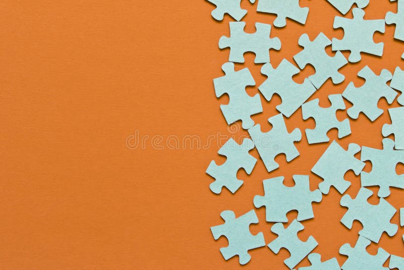 Puzzle. Many Puzzle Pieces on an Orange Background Stock Image - Image ...