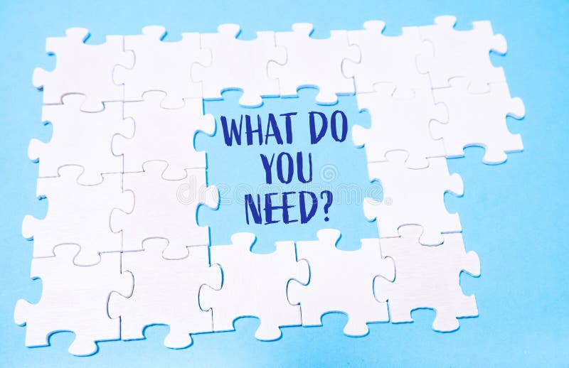 Puzzle Pieces with What Do You Need Text on a Blue Background Stock ...