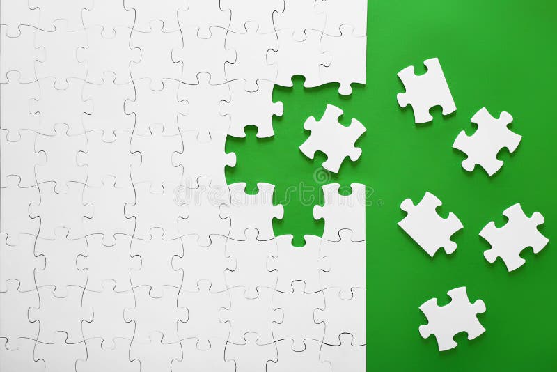 Puzzle Pieces on a Green Background Stock Photo - Image of piece ...