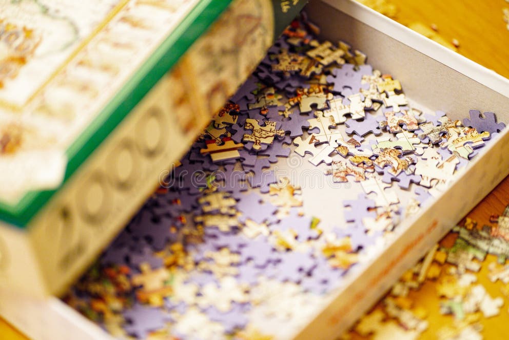 Puzzle Pieces Laying on Table with a Box Stock Photo - Image of play ...