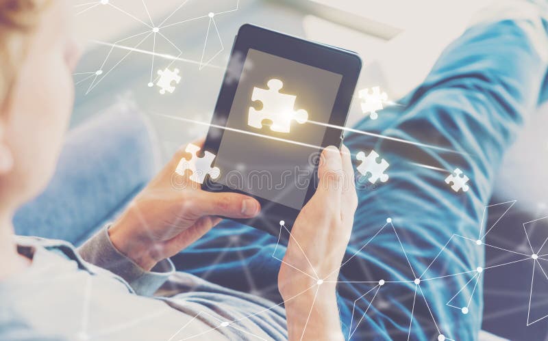 Puzzle Pieces with Man Using a Tablet Stock Photo - Image of tablet ...