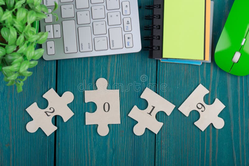 Puzzle Pieces with Text `2019`, Sketchbook, Computer Keyboard and Mouse ...