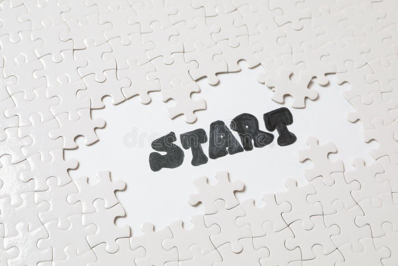 Puzzle Pieces and Word Start Written on White Background Stock Image ...