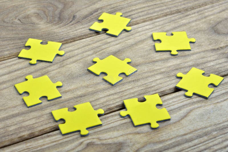 Puzzle on wooden table stock photo. Image of build, pieces - 74529218