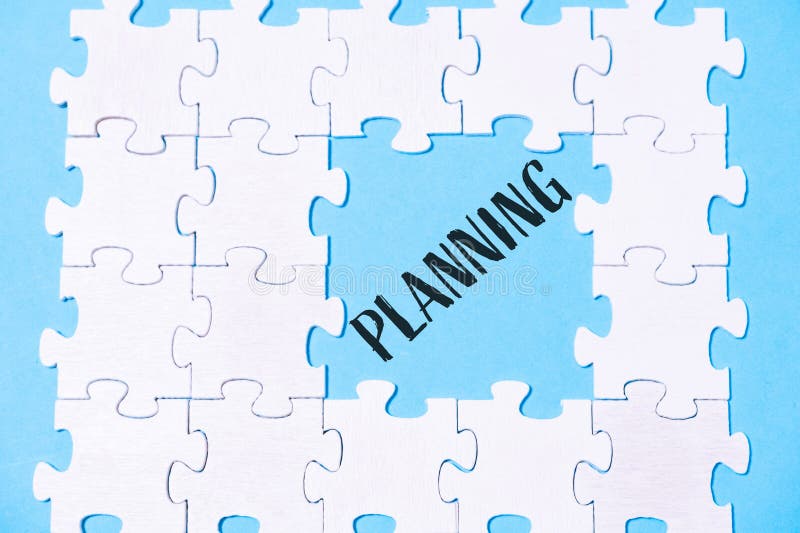 A Puzzle with the Word Planning Written in the Middle Stock Photo ...