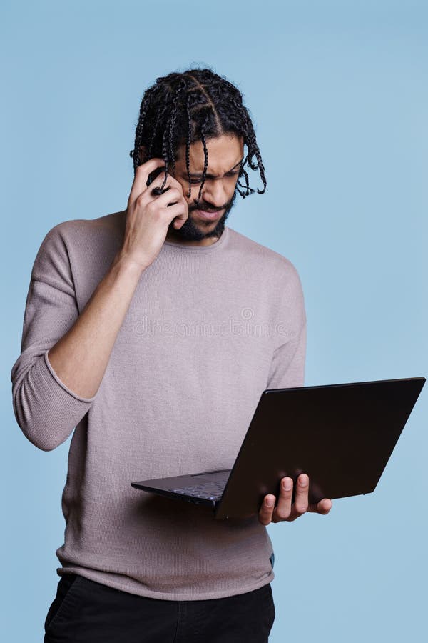 Puzzled Arab Programmer Solving Code Problem on Laptop Stock Image ... Puzzled Arab Programmer Solving Code Problem on Laptop Stock Image ...