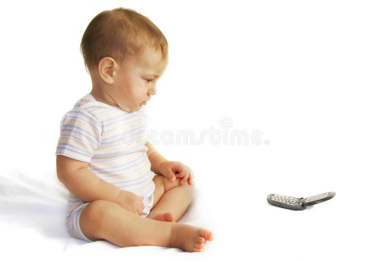 Puzzled Baby Boy Looking at Cell Phone Stock Image - Image of serious ...