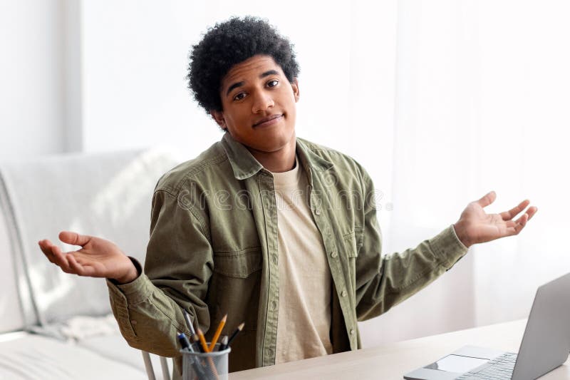 Puzzled Black Student Sitting in Front of Laptop, Not Understanding ...