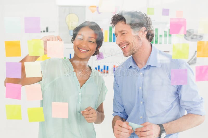 Puzzled Business Team Looking Post Its on the Wall Stock Photo - Image ...