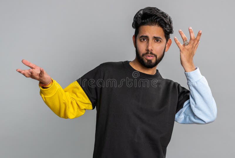 Puzzled Clueless Uncertain Man Raising Hands in Helpless, Embarrassed ...