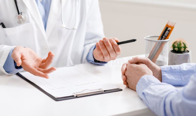 Puzzled Doctor Talking with Poor Senior Patient, Close Up Stock Photo ...
