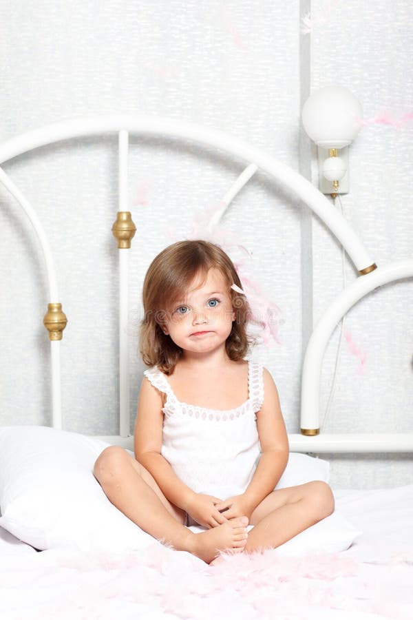 Puzzled little girl stock photo. Image of curly, daughter - 26847494