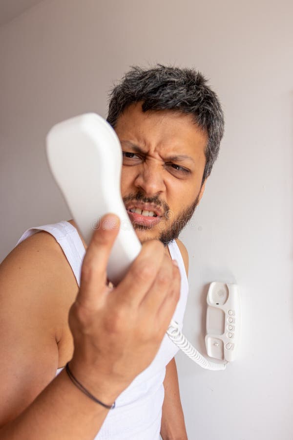 Man answering the phone stock photo. Image of device - 213542046