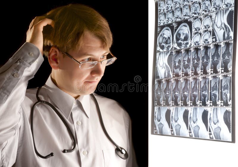 Puzzled Radiologist Looking at MRI Stock Photo - Image of injury ...