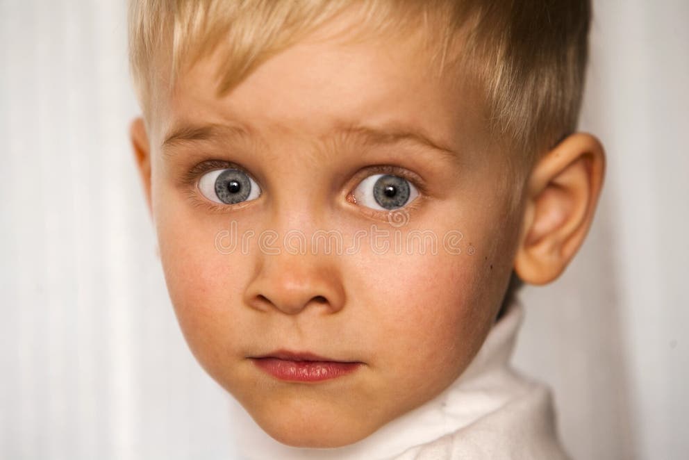 Puzzled young boy stock photo. Image of blond, closeup - 13845000